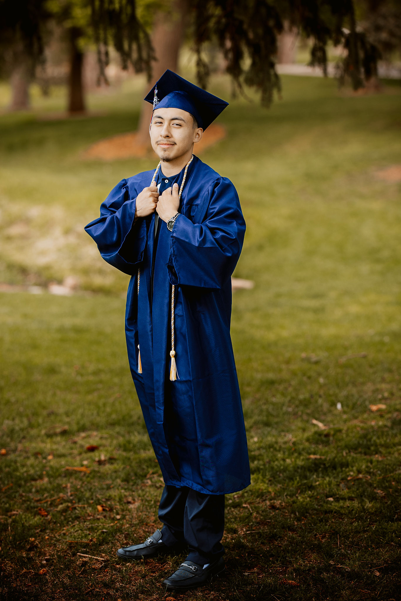 Isaac cap and gown by Illuminating Images